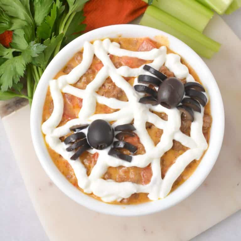 Beef Queso Dip (Spider Web Taco Dip) | Little Bit Recipes